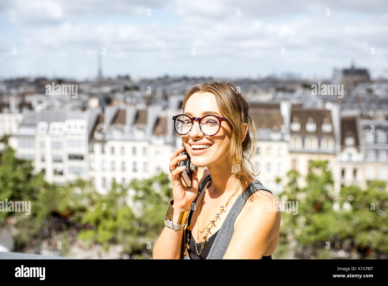Woman with phone in Paris Stock Photo - Alamy