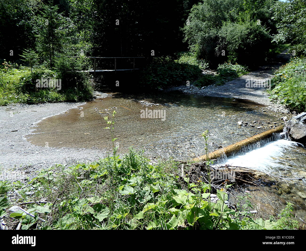 ford the river, small waterfall, artificial cascade on the river Stock ...