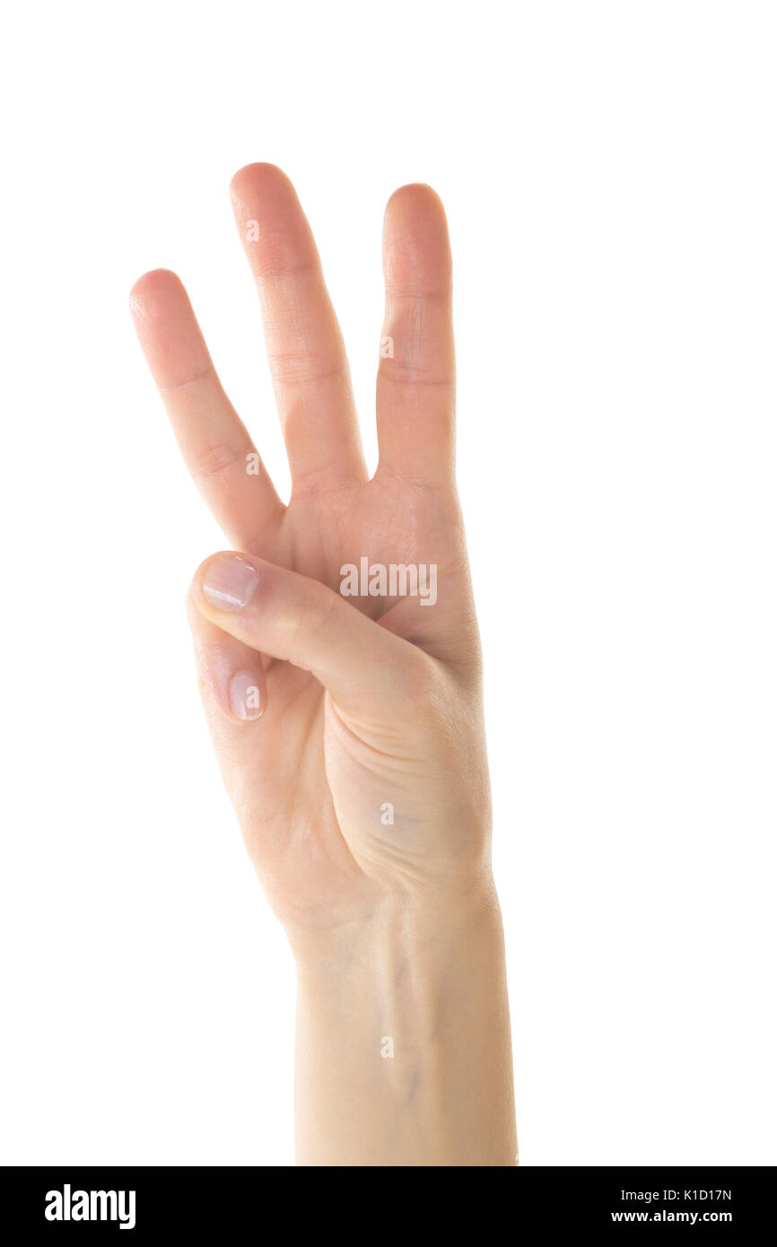 A gentle female hand is making number three sign with her right hand on ...