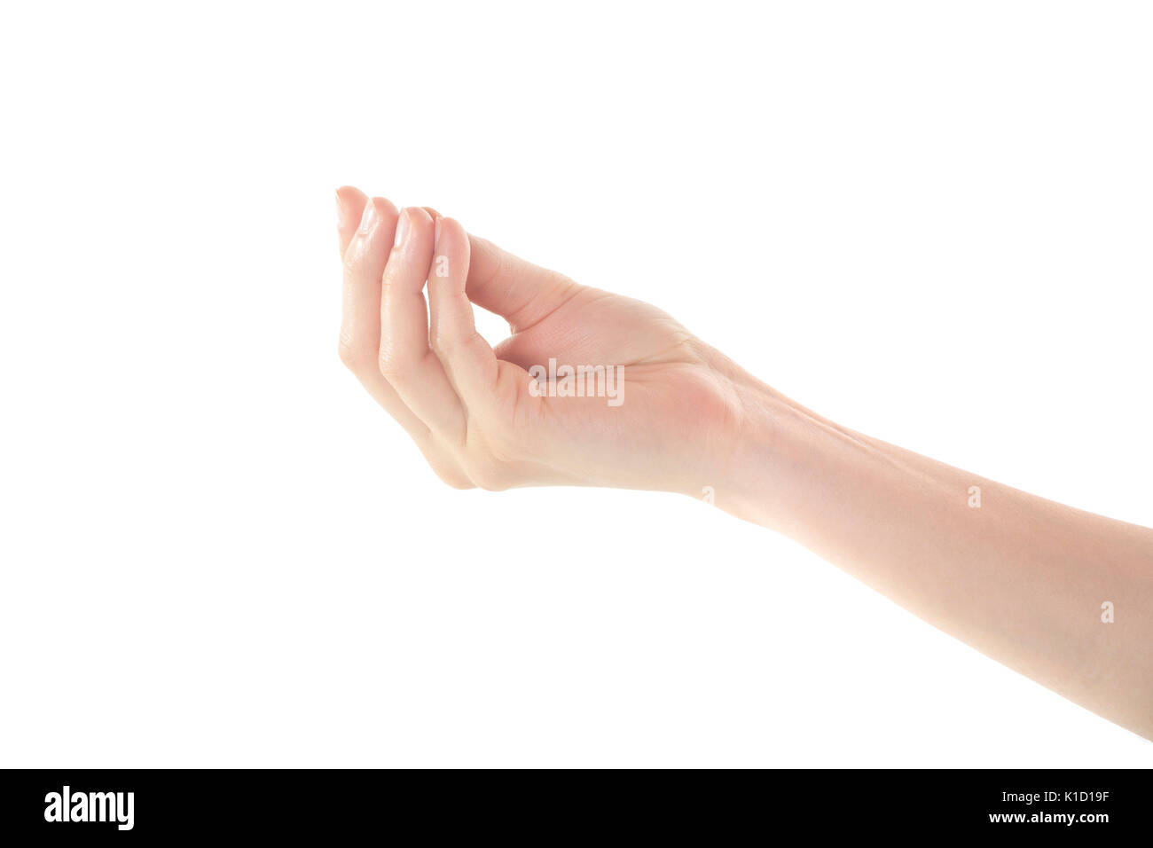 A gentle female hand is holding something gently with her right hand on ...