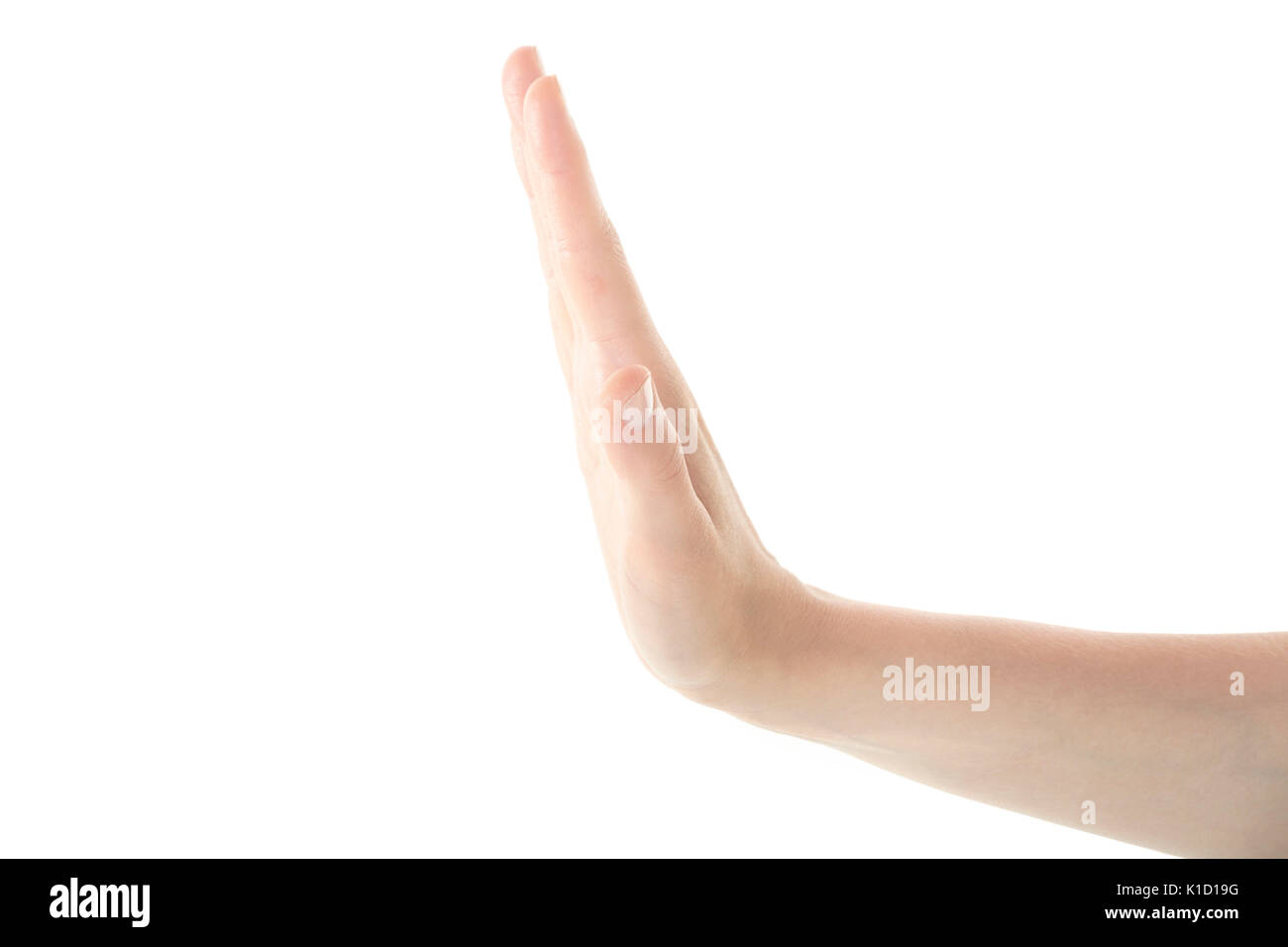 A gentle female hand is reaching with her right hand on isolated white ...