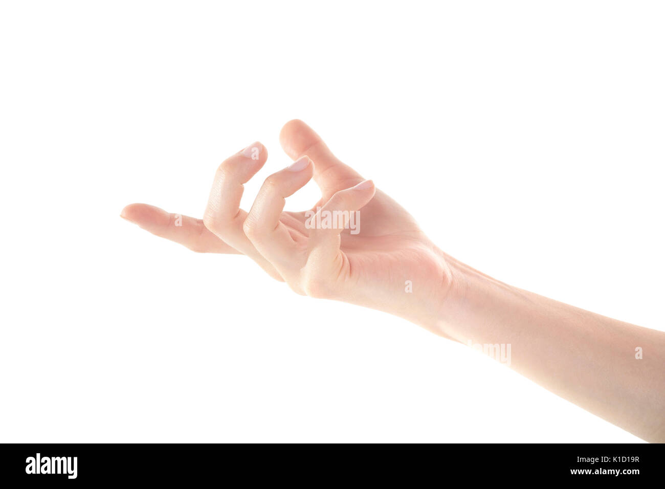 A gentle female hand is grabbing something with her right hand on ...