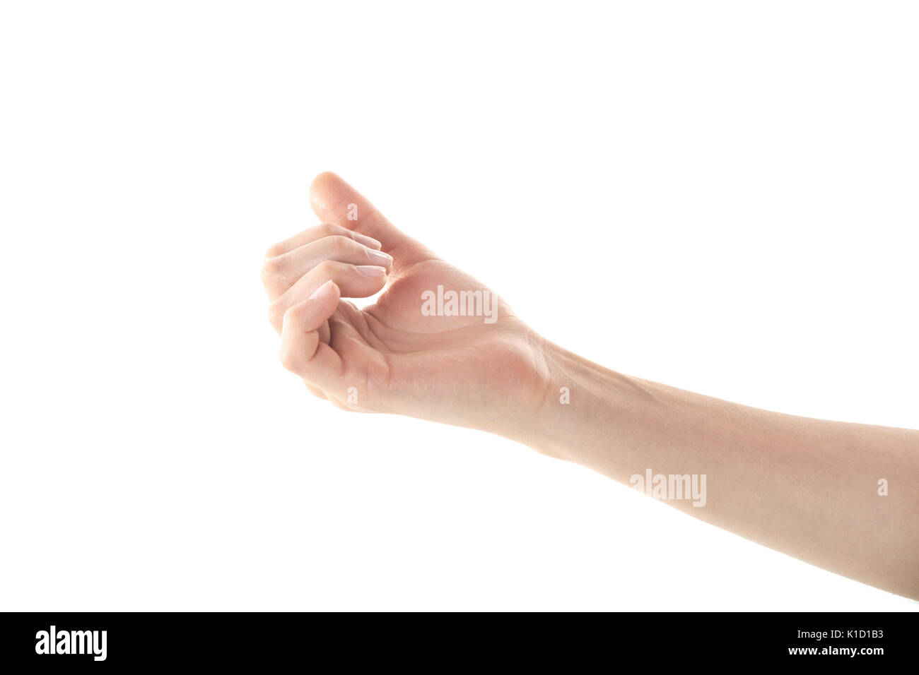 A gentle female hand is grabbing something with her right hand on ...