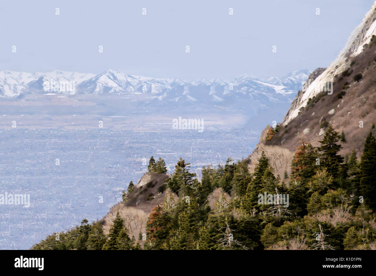 A steep mountain cliff in Butter field Canyon Utah looking down into ...