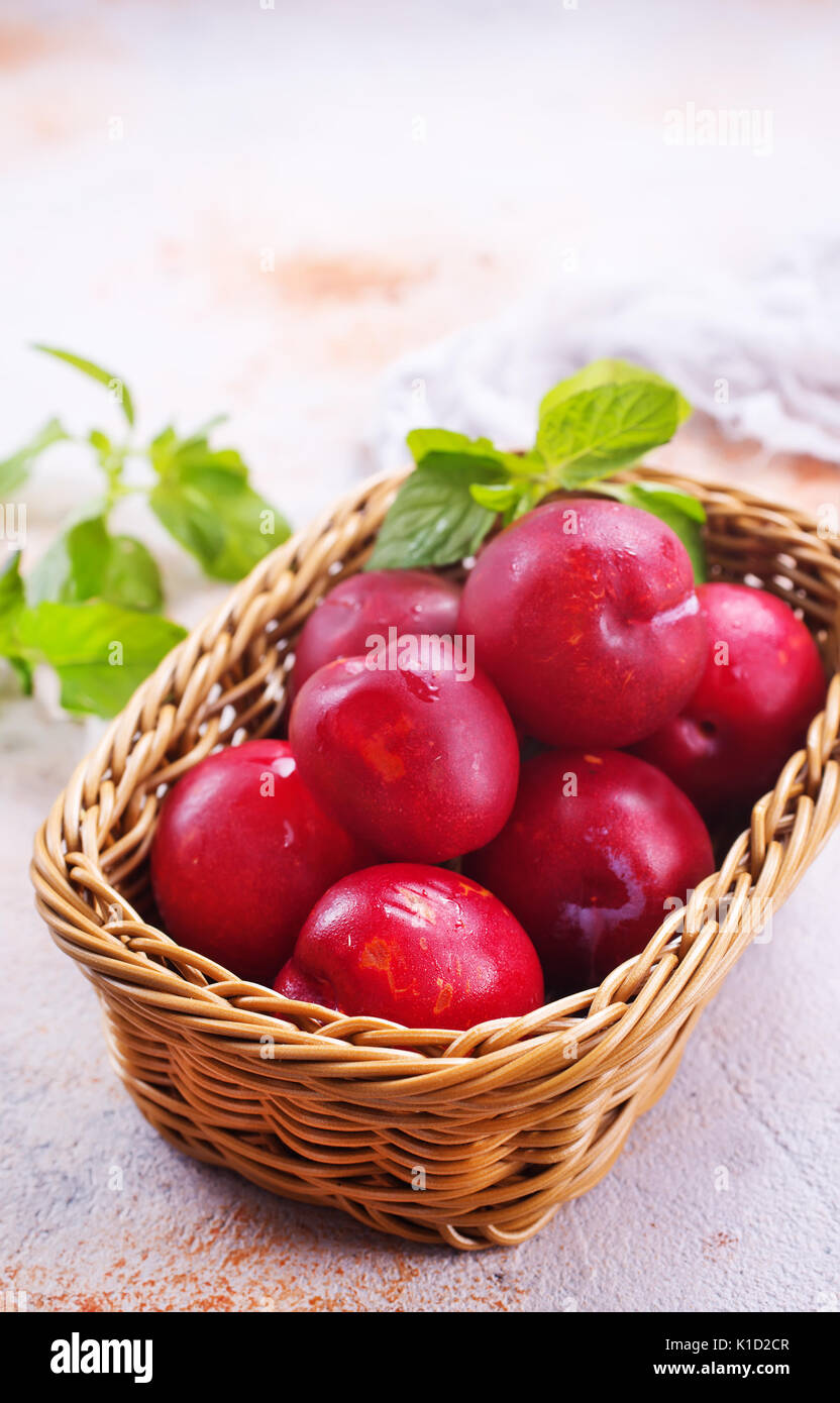 fresh plums on a table, stock photo Stock Photo - Alamy