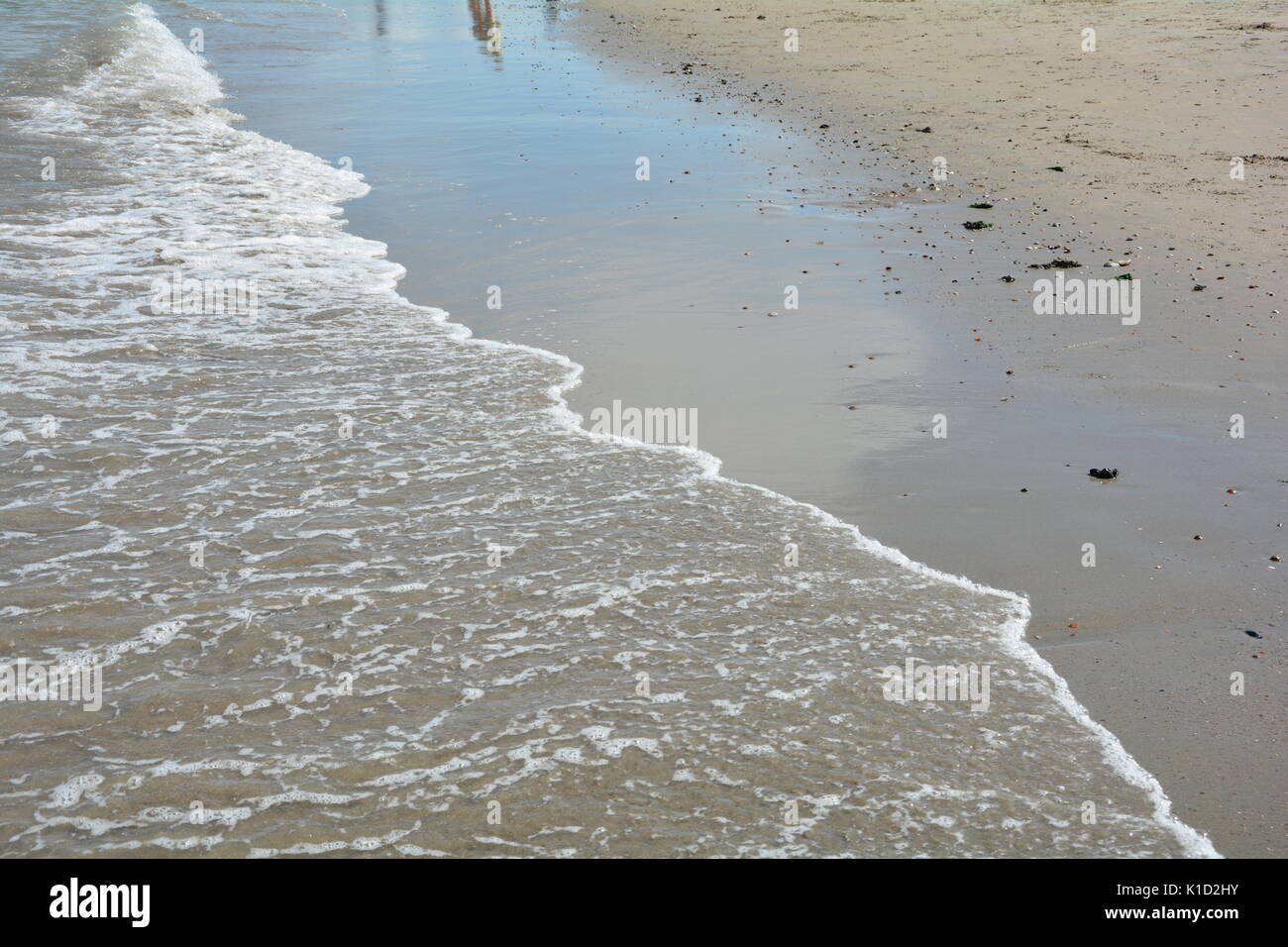 Waves on sand beach Stock Photo - Alamy