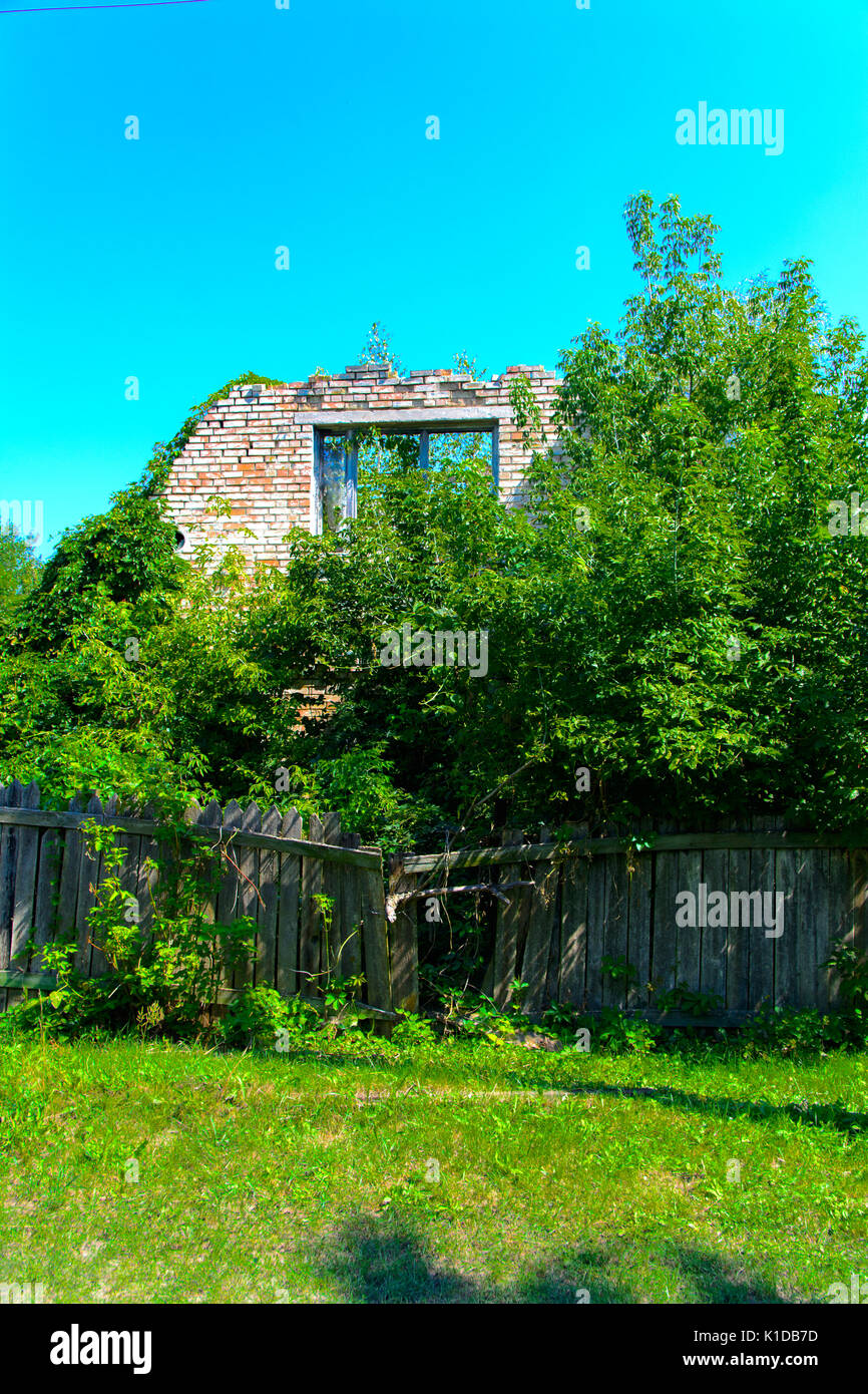 Destroyed houses in which people lived in a dead radioactive zone ...