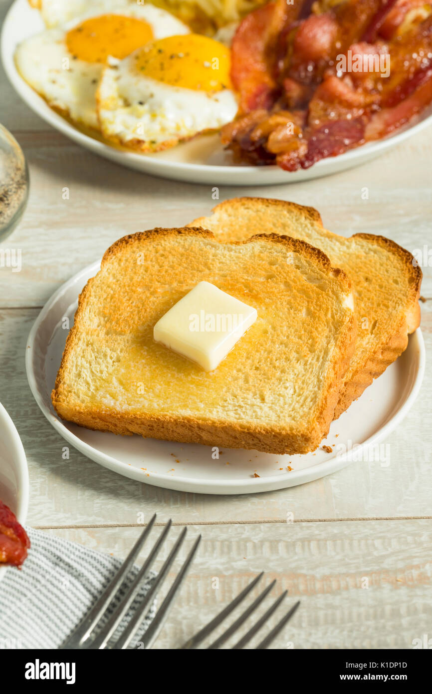 Healthy White Bread Toast with a Pad of Butter Stock Photo - Alamy