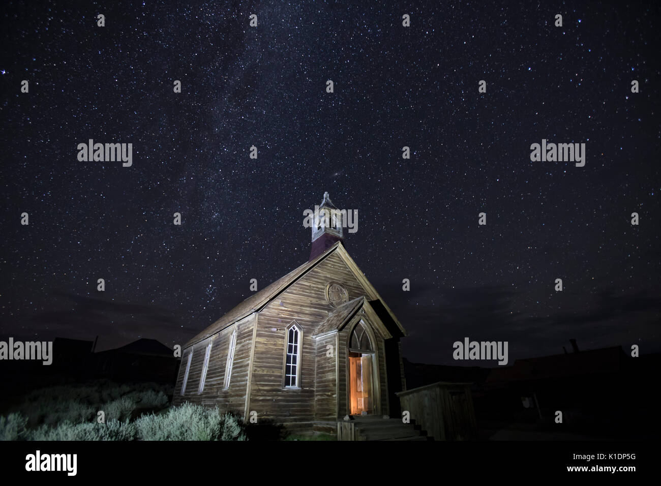 Methodist church illuminated against night skies in Bodie State Historic Park Stock Photo - Alamy