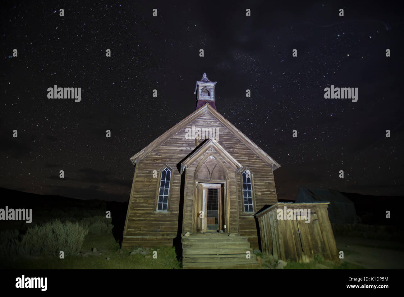 Methodist church illuminated against night skies in Bodie State Historic Park Stock Photo - Alamy