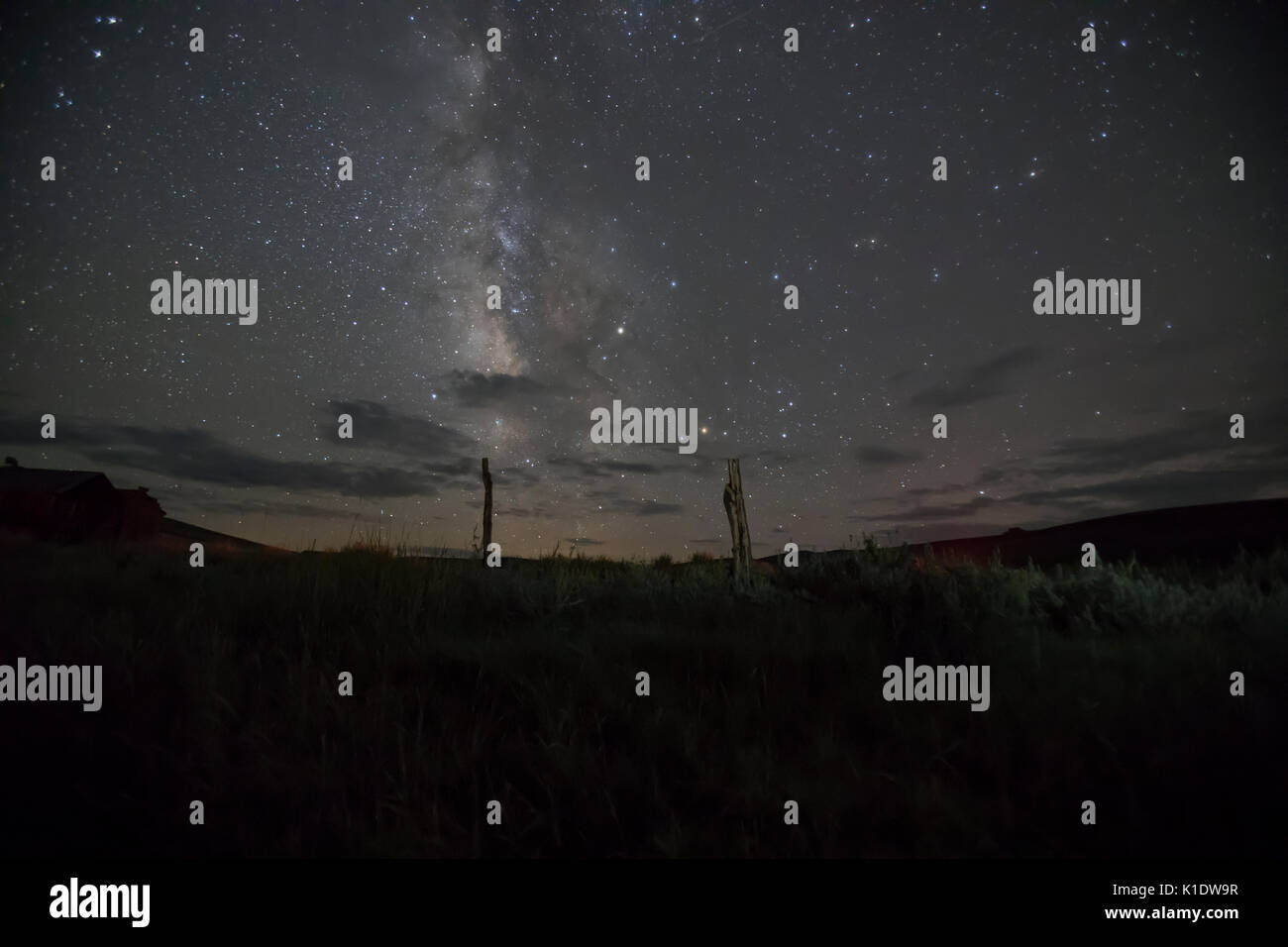 Milky Way in night skies over fence posts in rural field Stock Photo ...