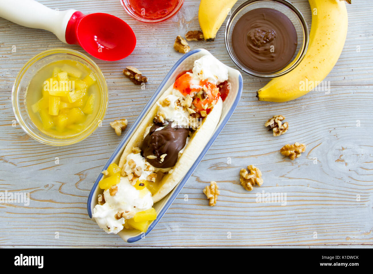Deconstructed banana split ingredients on rustic wood Stock Photo - Alamy