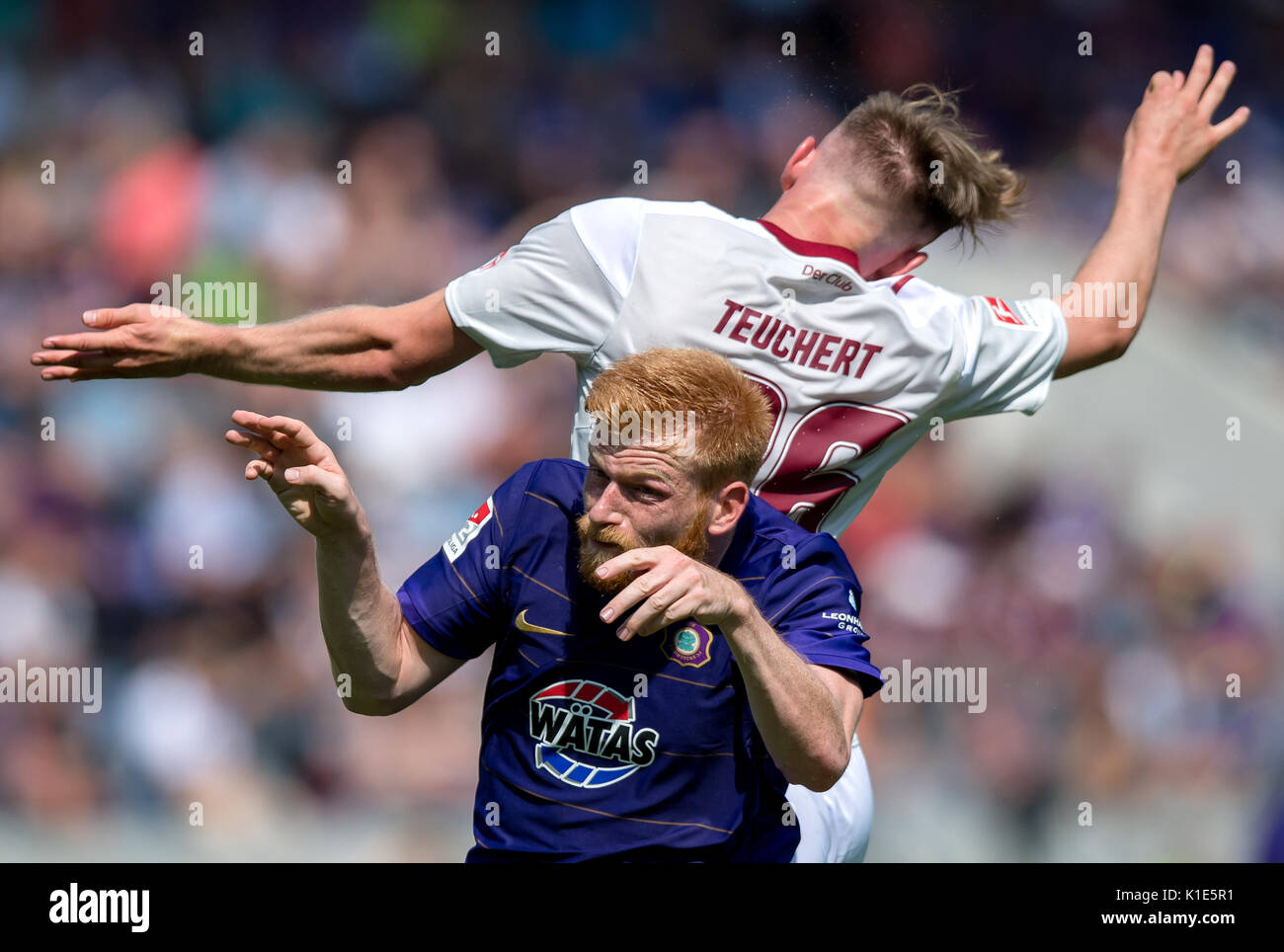 Nuremberg's Cedric Teuchert (back) and Aue's Fabian Kalig bump into ...