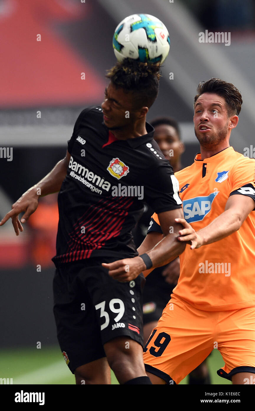 Leverkusen's Benjamin Henrichs (L) and Hoffenheim's Mark Uth in action ...
