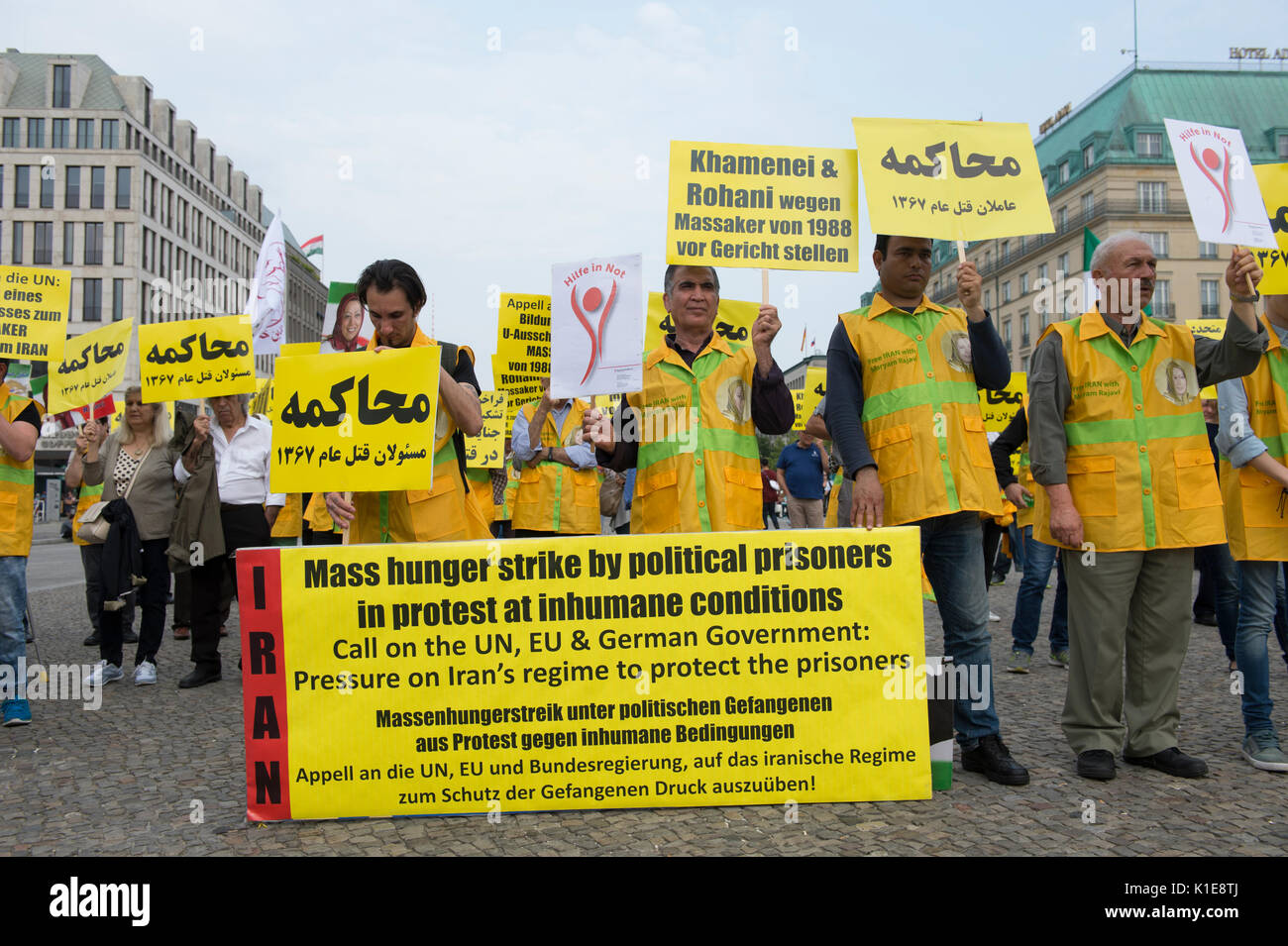 Berlin, Germany. 26th Aug, 2017. Demonstrators pose with banners and ...