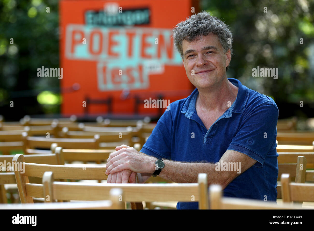 Erlangen, Germany. 26th Aug, 2017. dpatop - Author Renus Berbig sits in ...