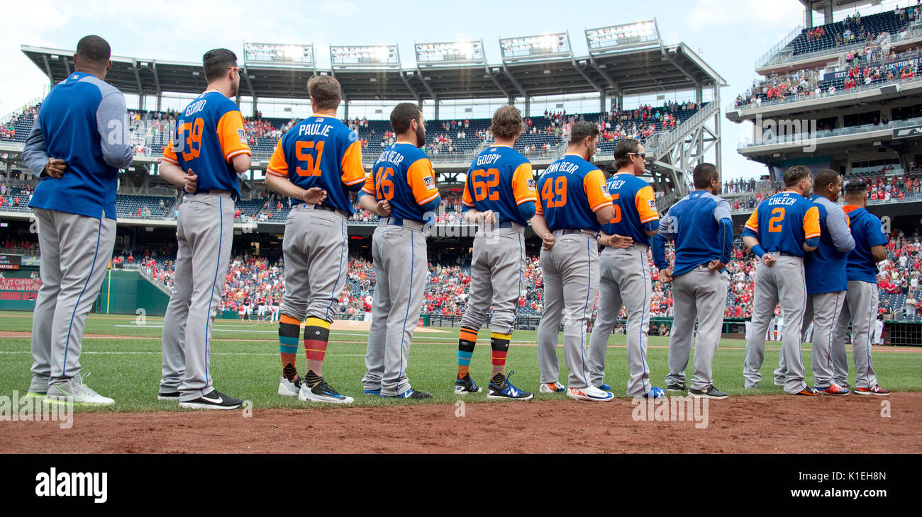 New York Mets stand in attention as the National Anthem is played prior ...