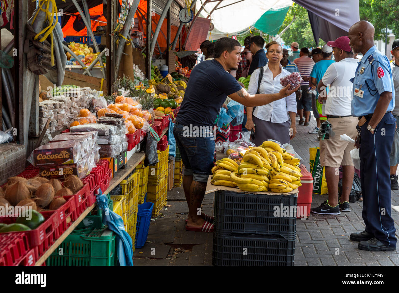 Willemstad, Curacao, Lesser Antilles. Fruit Vendor Offering Grapes to ...