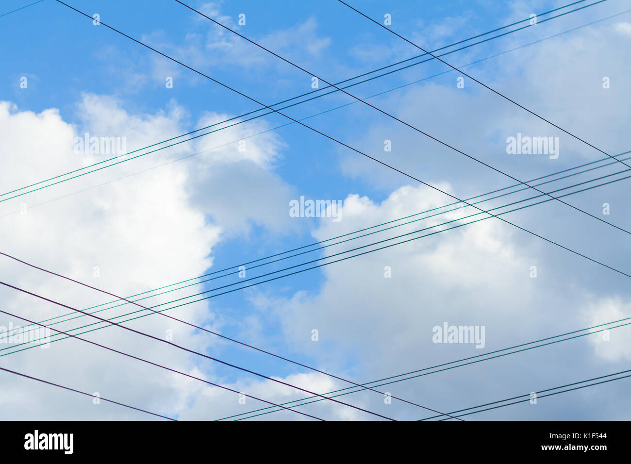 The electric cables that crossing on the blue sky (abstract Stock Photo ...