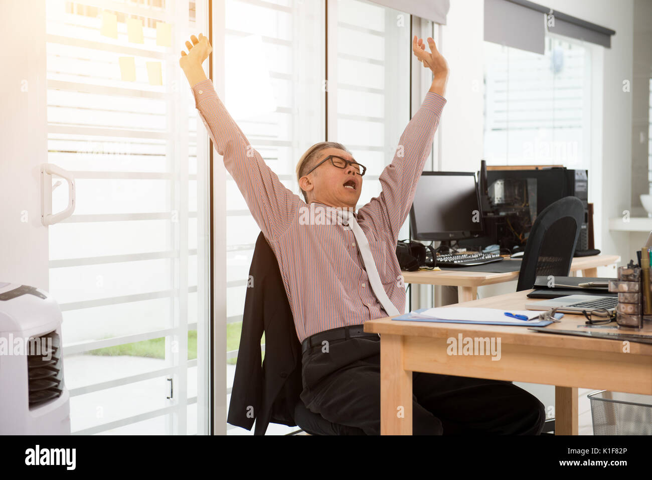 asian senior business man sleepy at work Stock Photo - Alamy