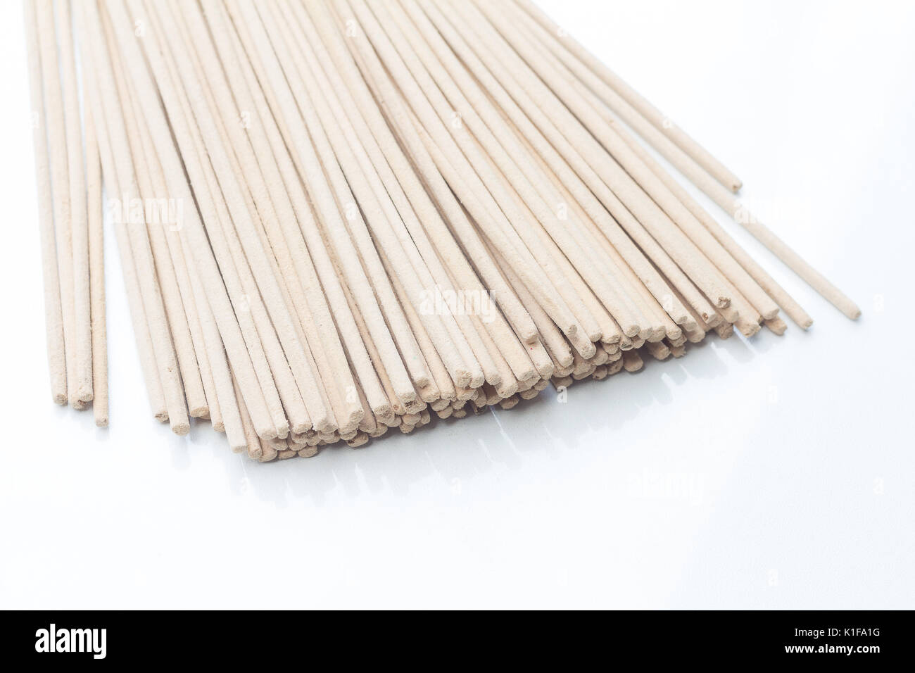 Many incense sticks isolated on white background Stock Photo - Alamy