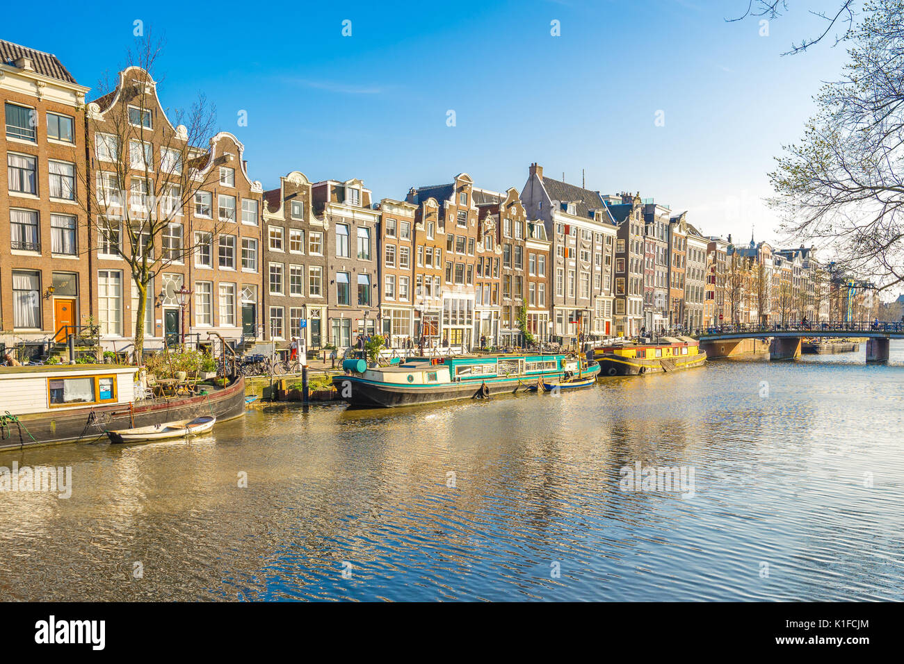 Dutch house style with the canal in Amsterdam city, Netherlands Stock ...