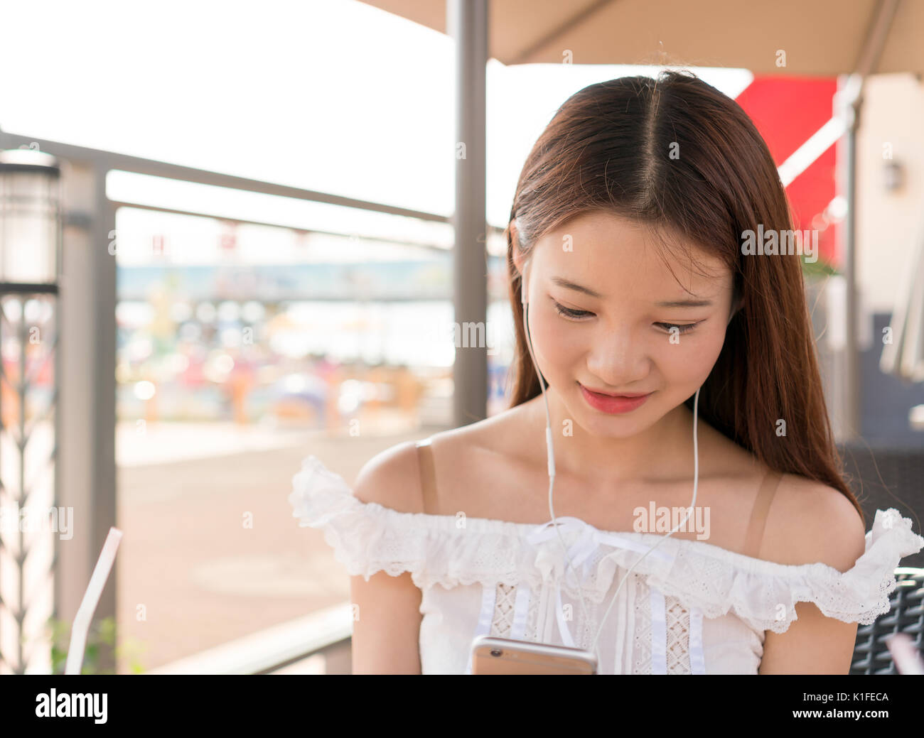 Chinese girls playing phone Stock Photo - Alamy