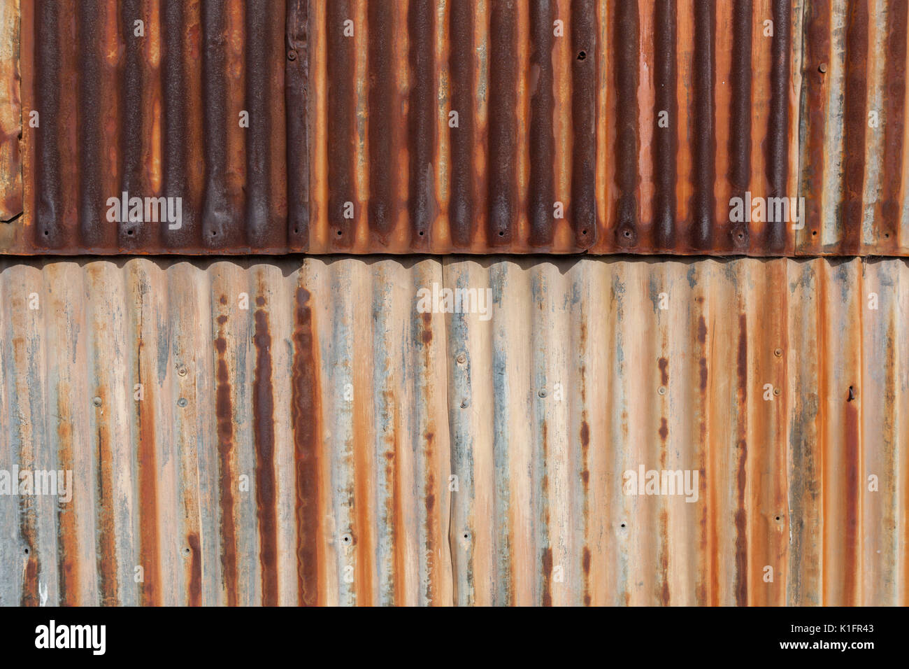 Rusty galvanized iron sheets background pattern Stock Photo - Alamy