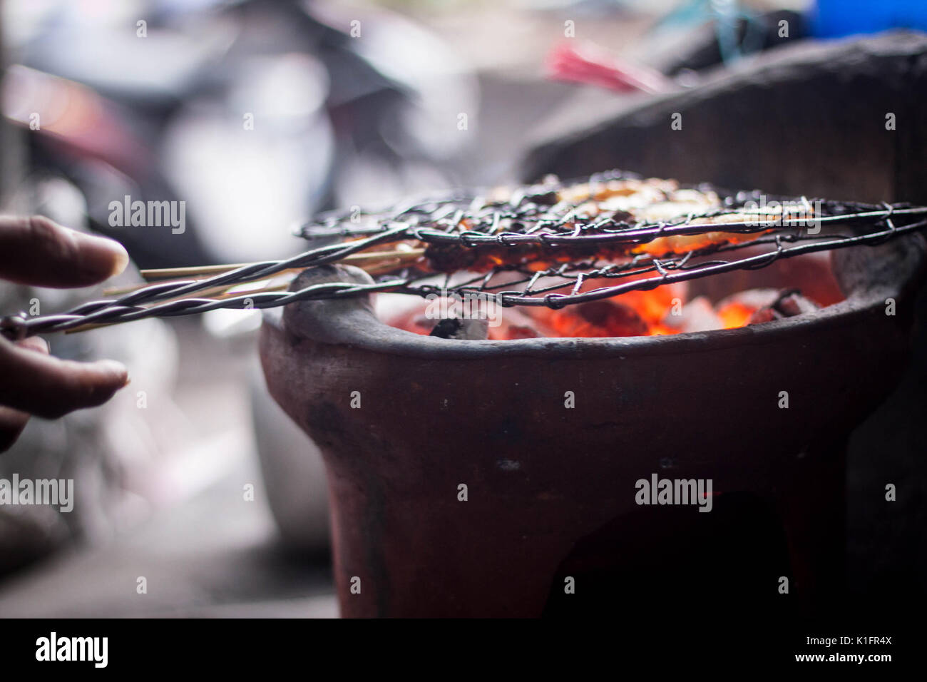 grill sate and tempe at iconic traditional food angkringan with hand ...