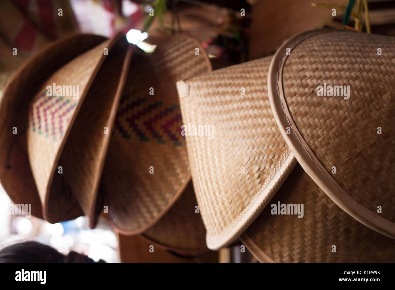 a traditional bamboo hat hanging on top java Stock Photo - Alamy