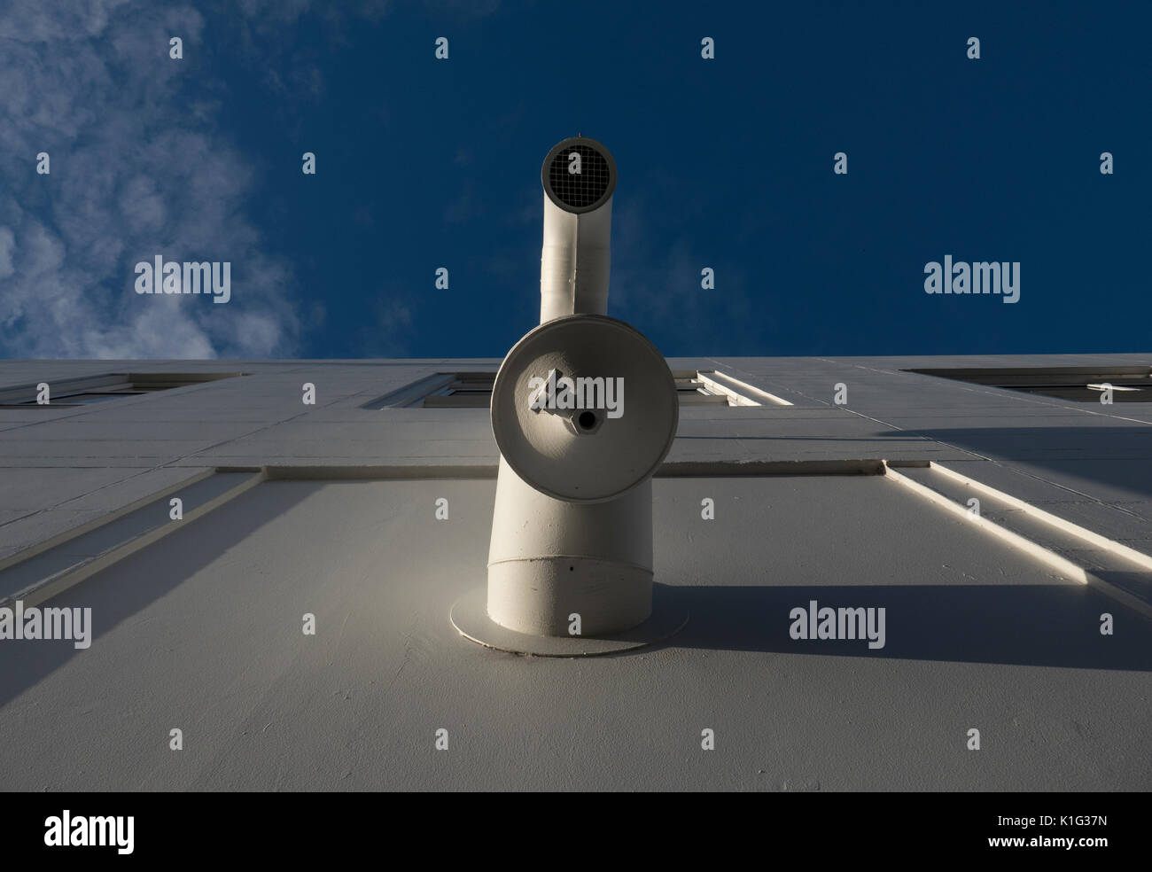 Interesting pipe on side of building Stock Photo - Alamy
