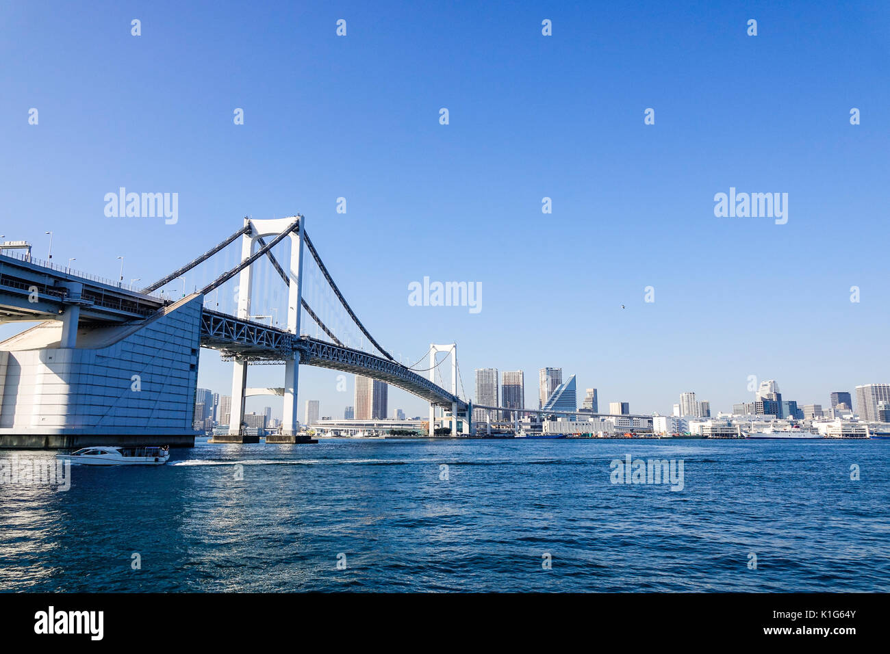 Tokyo, Japan - Jan 4, 2016. Rainbow Bridge with modern buildings ...