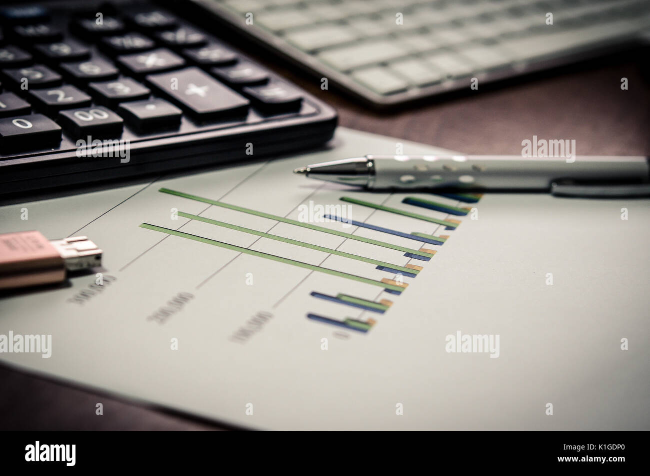 paper work desk and keyboard and pen report chart on desk. Business ...