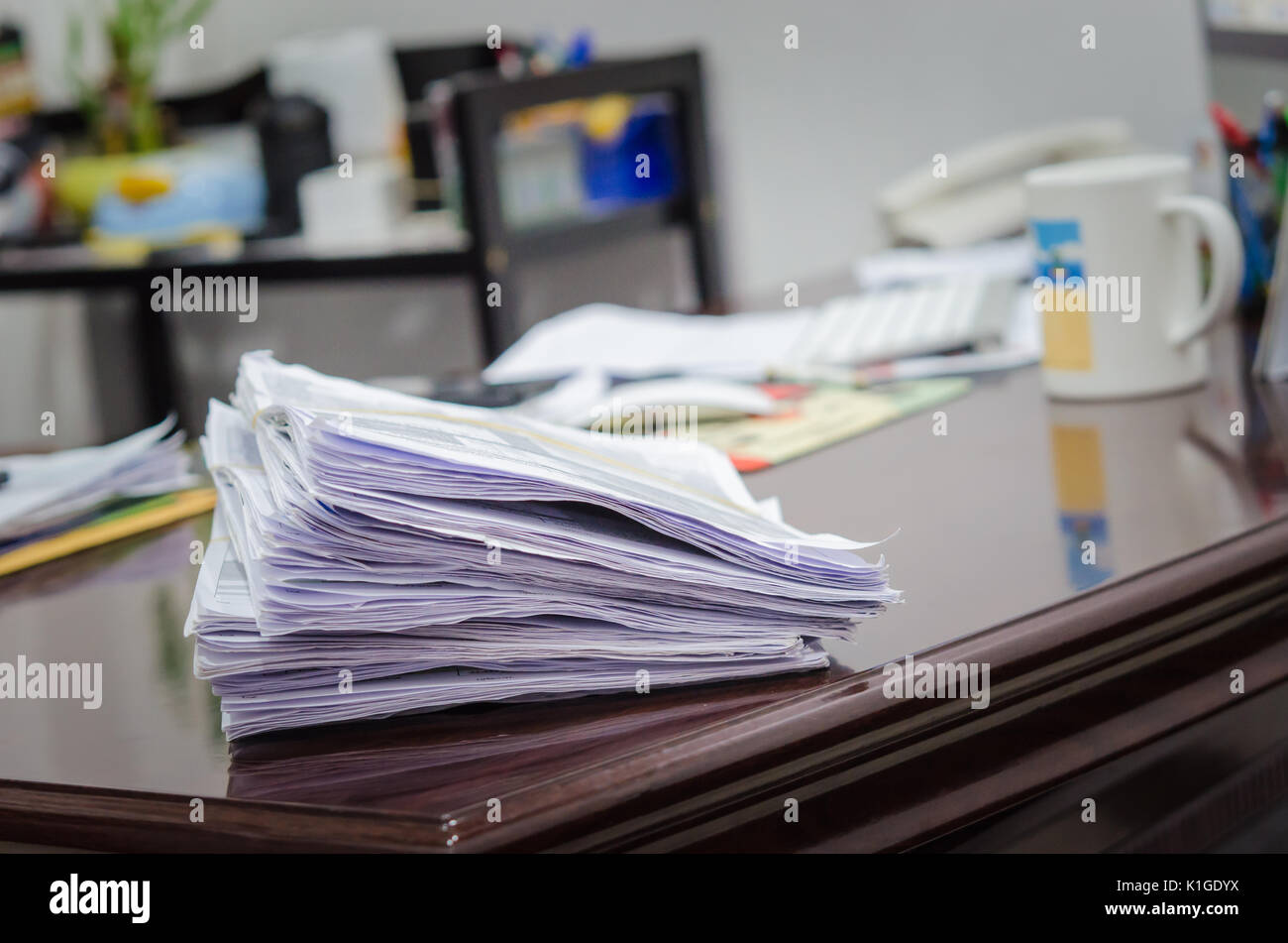 Pile of documents on desk Stock Photo - Alamy