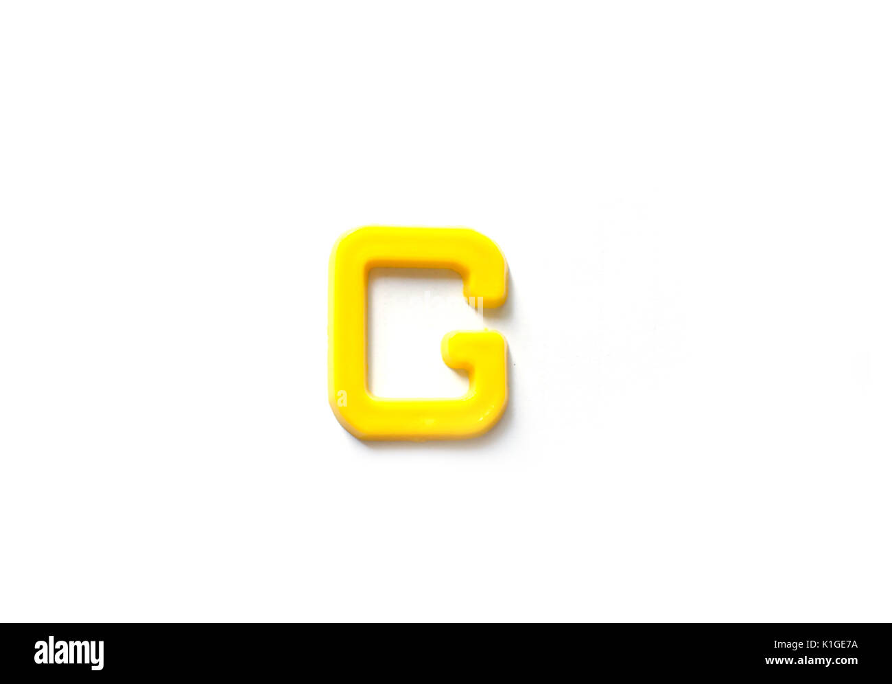 Plastic letters G isolated white background Stock Photo - Alamy