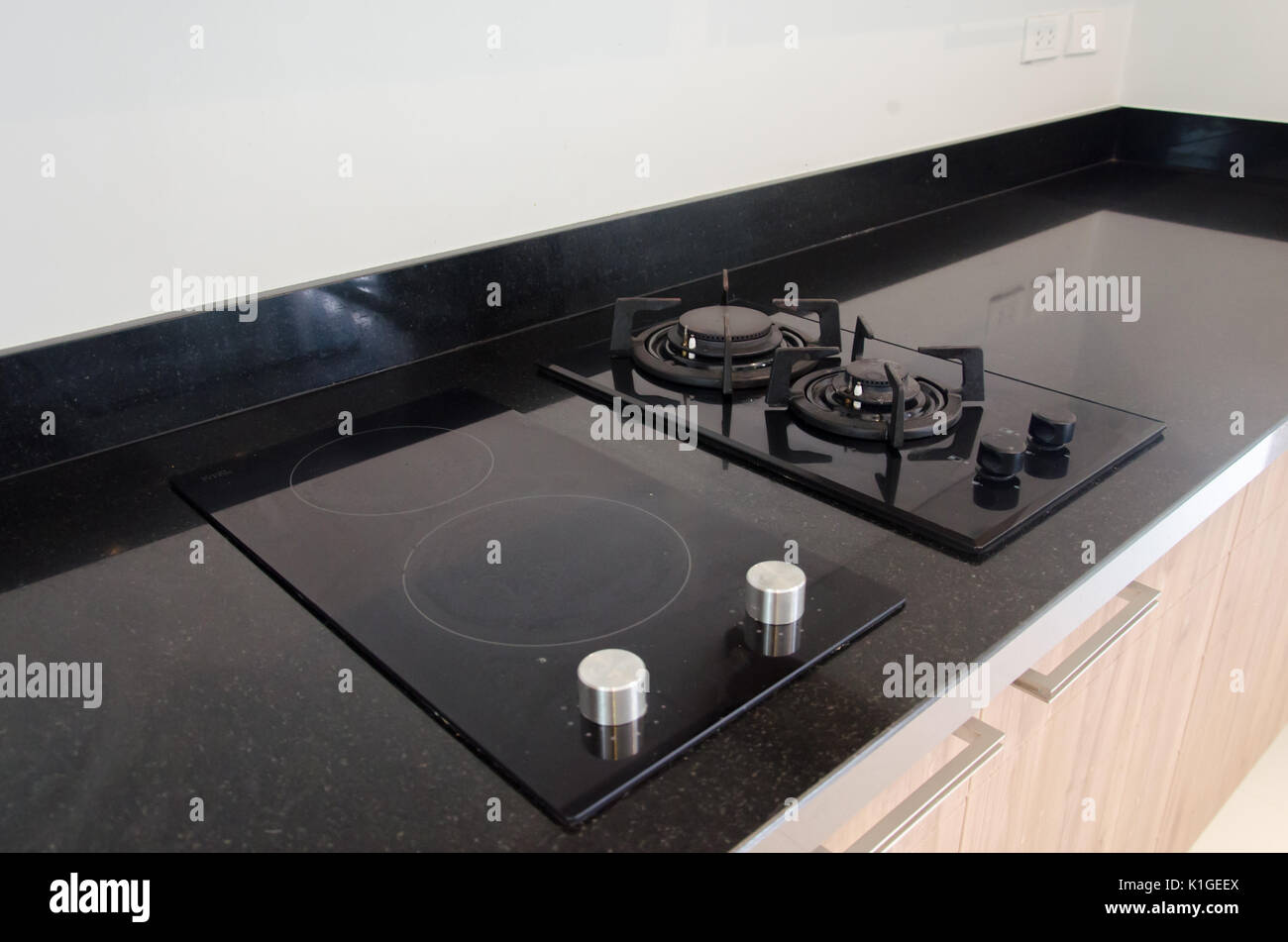 modern gas stove on countertop in kitchen Stock Photo - Alamy
