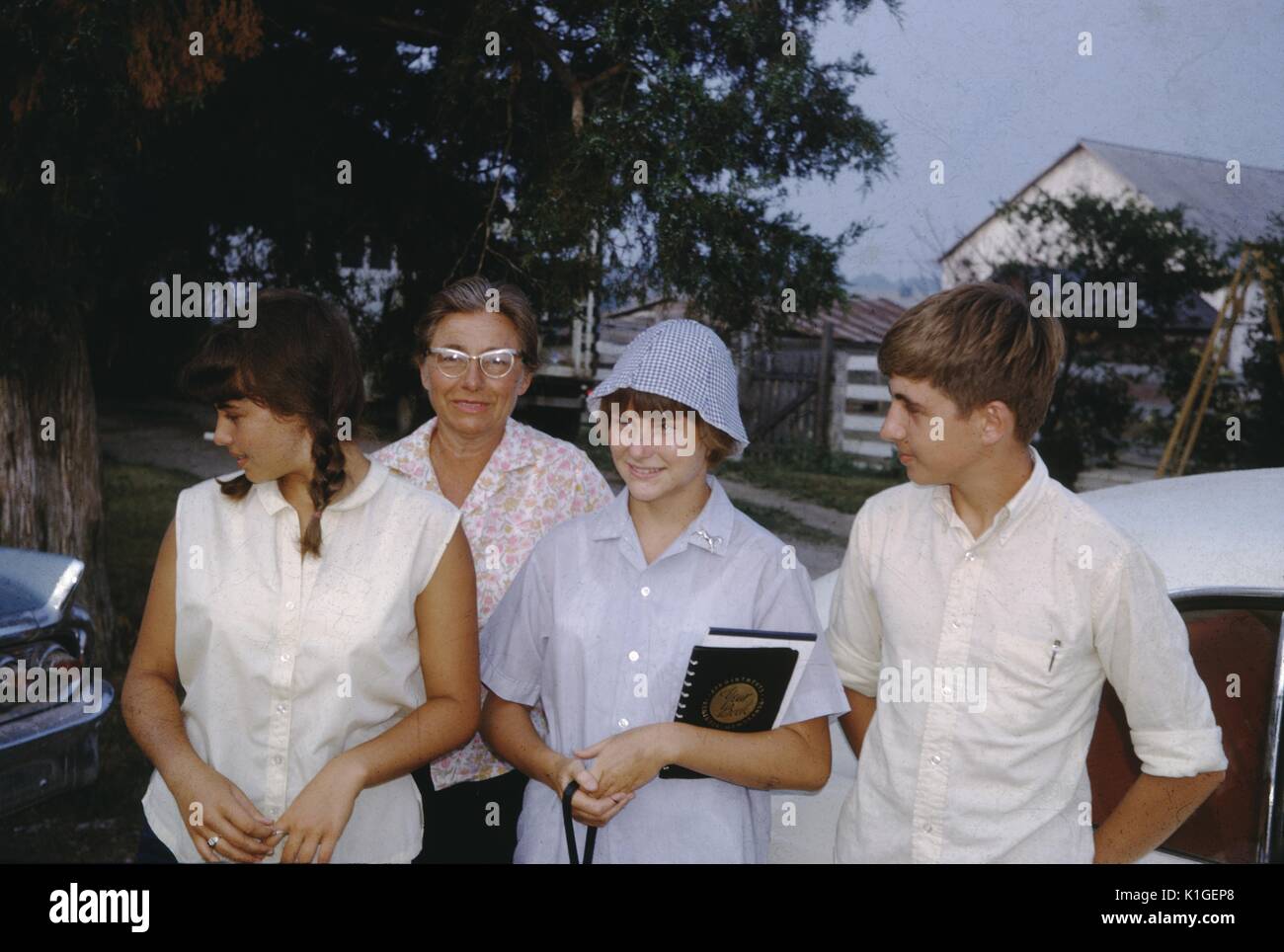 Vernacular snapshot photograph of family and blouses, 1966 Stock Photo ...
