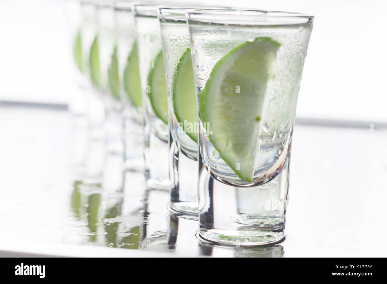 Alcohol cocktail with lime Stock Photo - Alamy
