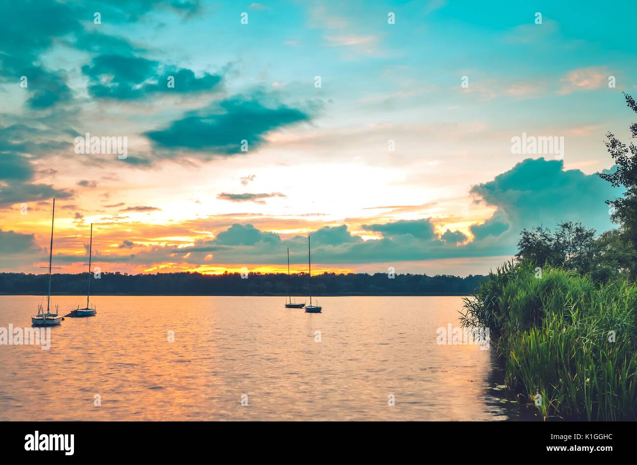 Boats on a beautiful lake. Evening summer landscape by the water Stock ...