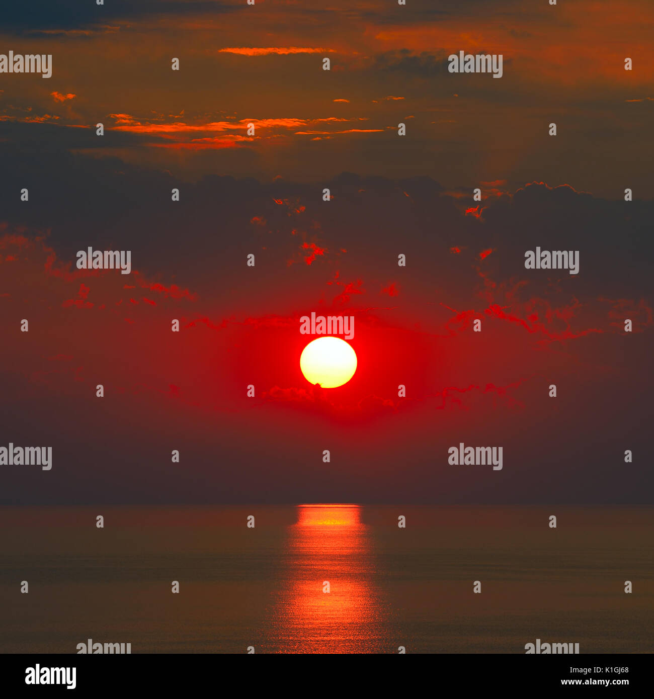 Sunrise with sun track on sea Stock Photo - Alamy