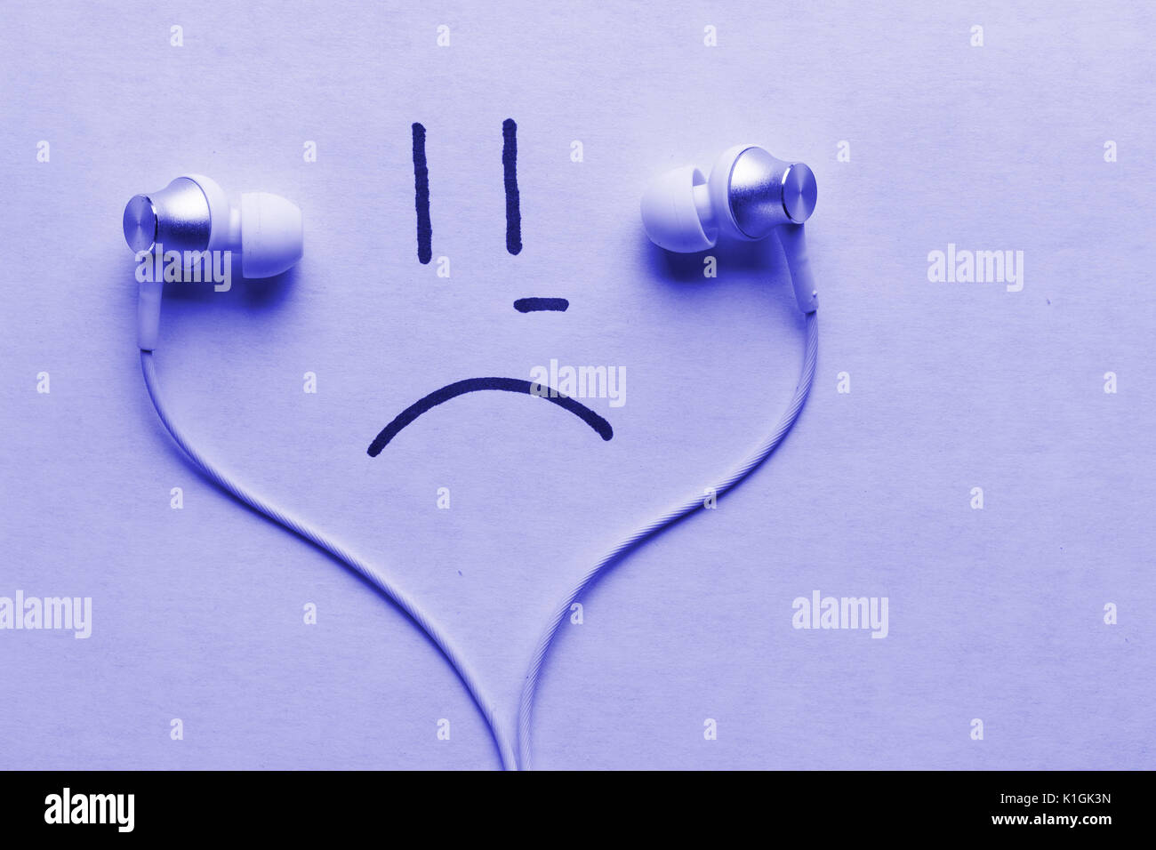 listen to sad music concept. headphones and sad smile Stock Photo - Alamy