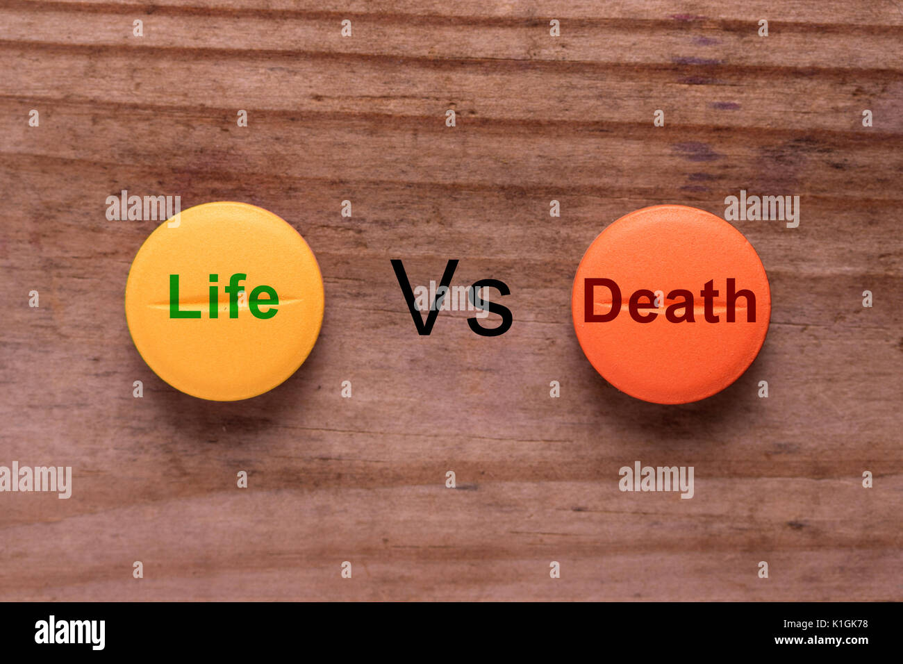 terminal illness treatment concept. pill with words life vs death Stock ...