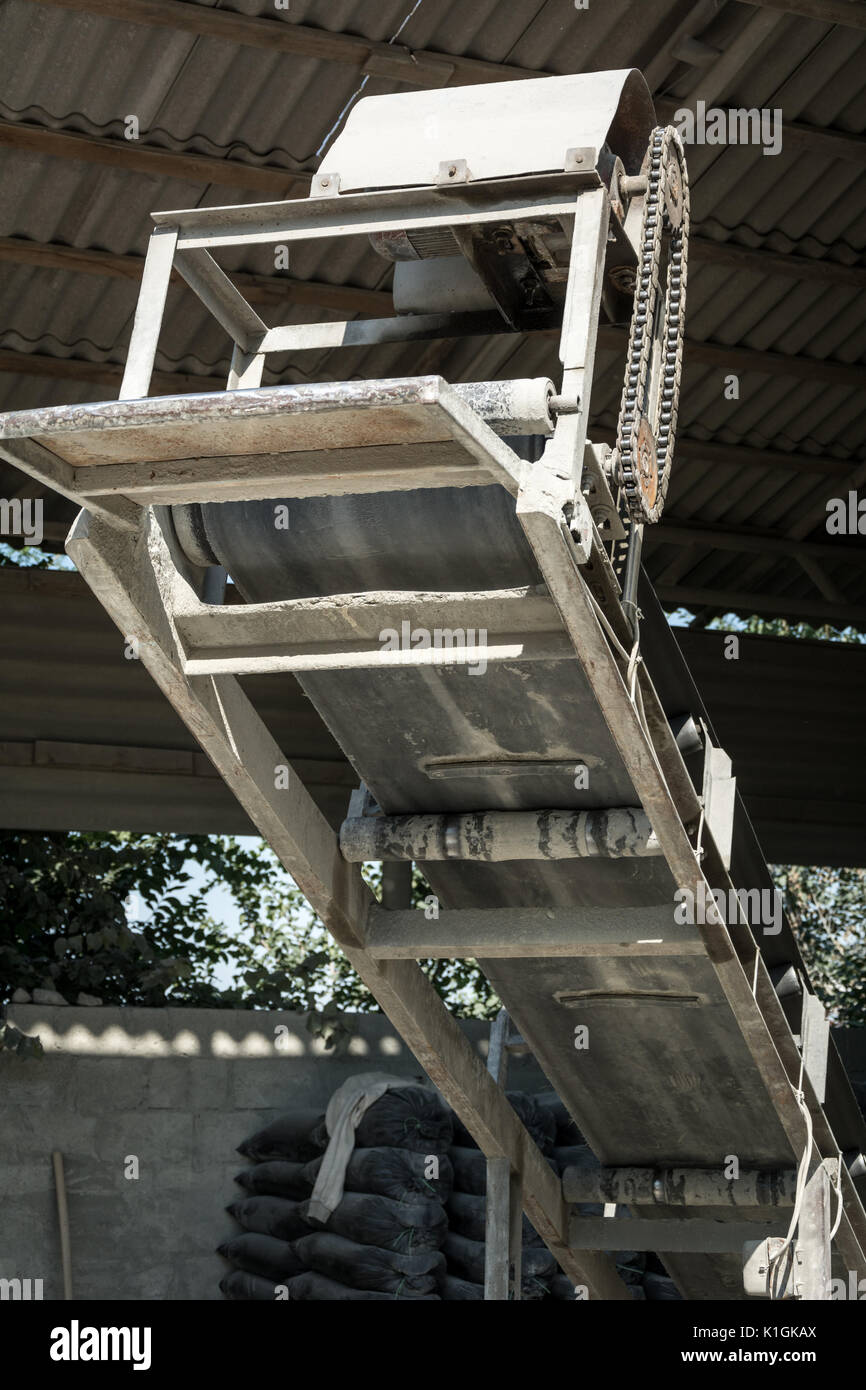 Conveyor cement loader for a truck Stock Photo - Alamy