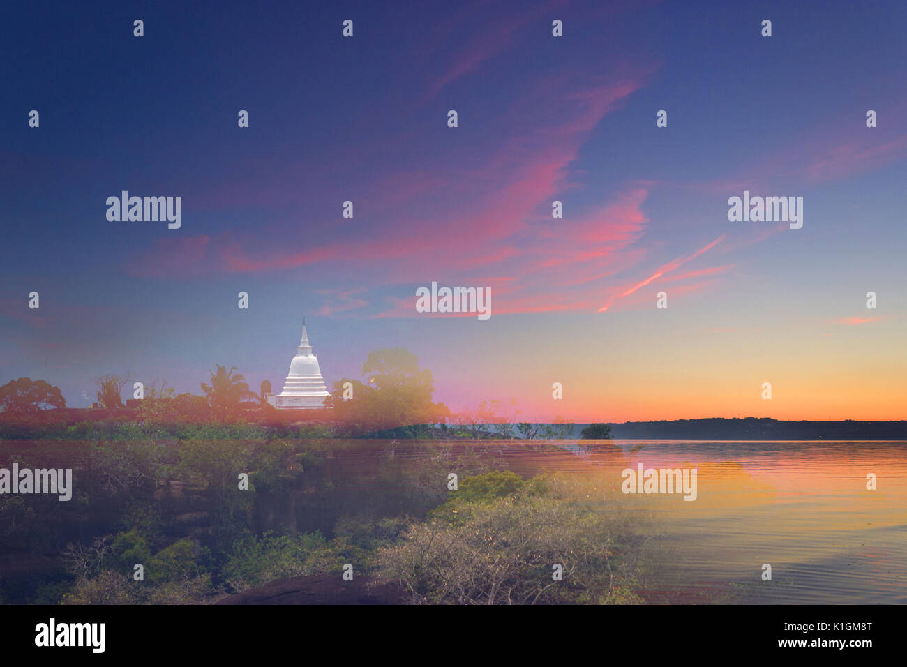 beautiful Scenic sunset over ocean and white pagoda Stock Photo - Alamy