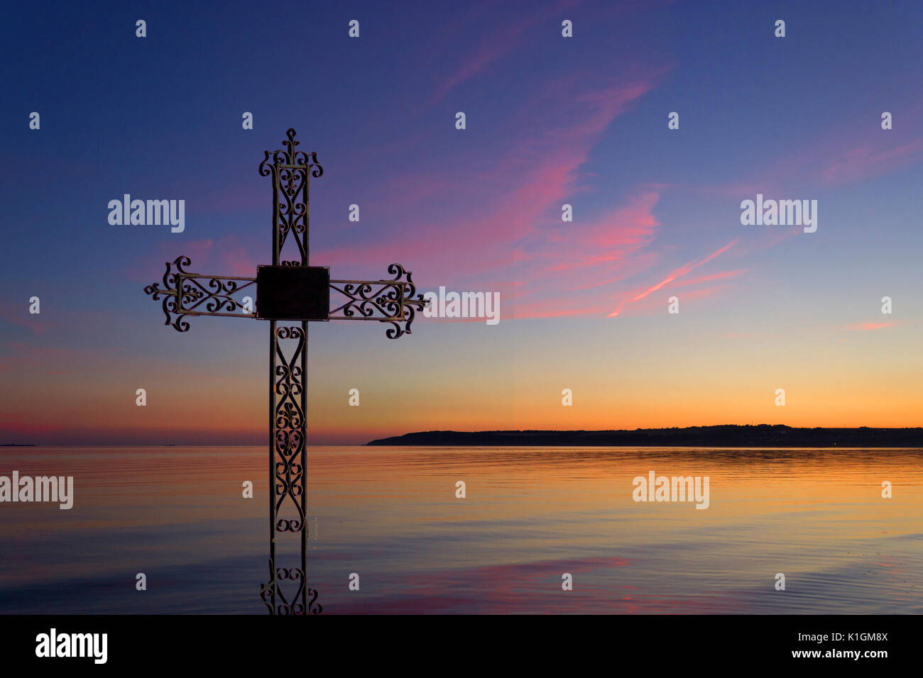 beautiful Scenic sunset over ocean beach and a cross Stock Photo - Alamy