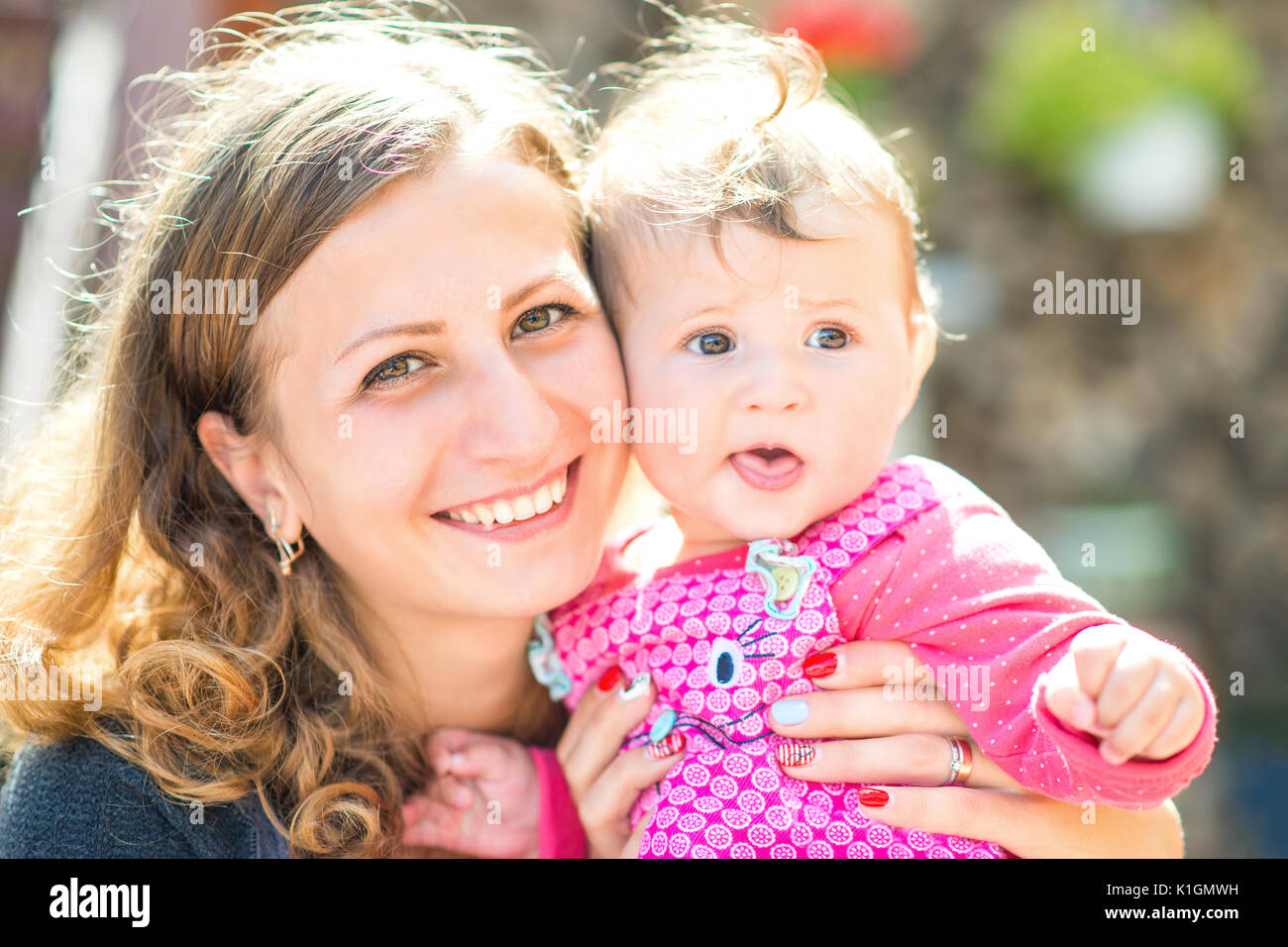 Close up portrait of beautiful mother and baby outdoors. Outdoor ...
