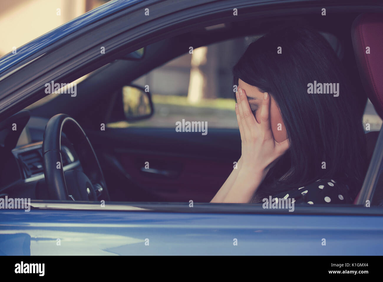 Stressed young woman driver sitting inside her car Stock Photo - Alamy