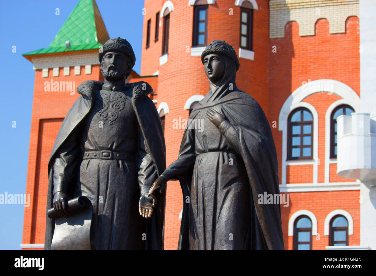 sculptures of man and woman. owners of medieval castle Stock Photo - Alamy