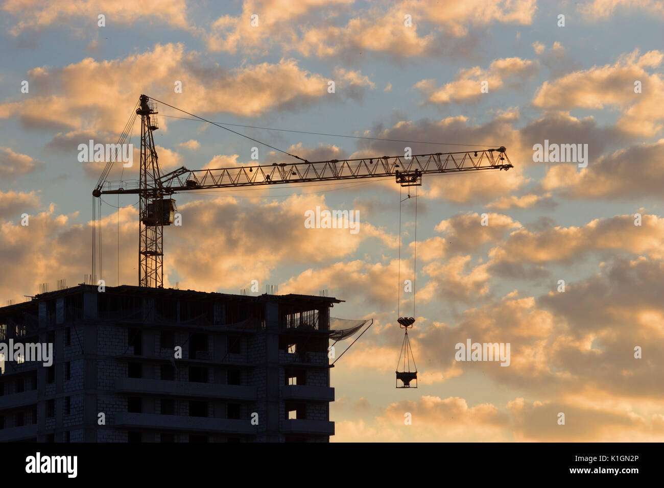 Construction of the building at sunset time lapse Stock Photo - Alamy