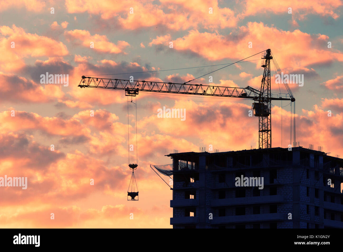 Construction of the building at sunset time lapse Stock Photo - Alamy